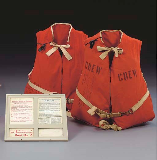 A set of four orange Kapok life jackets with whistles and life boat ...