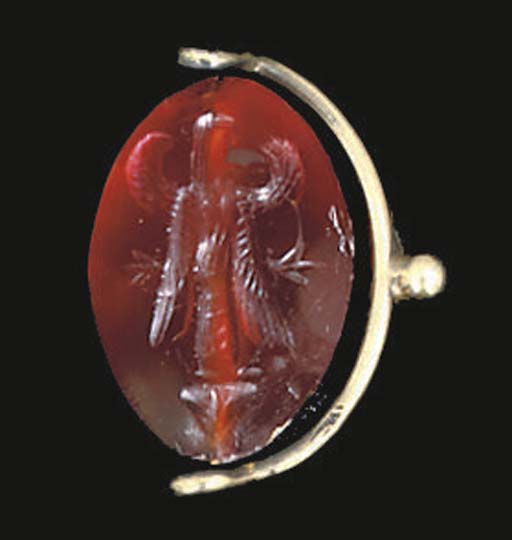 A CLASSICAL PHOENICIAN CORNELIAN WINGED GENIE SEAL