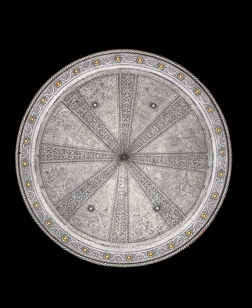 A GERMAN ETCHED CIRCULAR SHIELD, IN LATE 16TH CENTURY STYLE