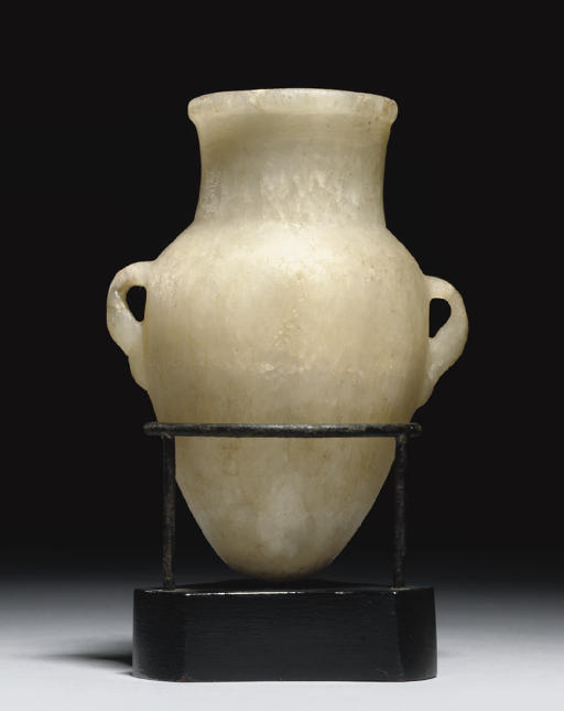 AN EGYPTIAN ALABASTER JAR