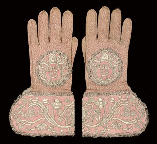 A PAIR OF PINK SILK EPISCOPAL GAUNTLETS, EARLY 17TH CENTURY, PROBABLY ...