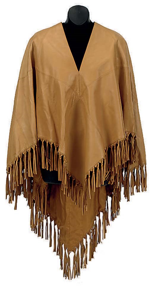AN HERMÈS SOFT LEATHER TAN PONCHO WITH FRINGE TRIM , FRENCH, LABELED ...