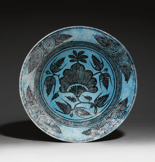A TIMURID BLACK, WHITE AND TURQUOISE GLAZED POTTERY DISH , CENTRAL ASIA ...