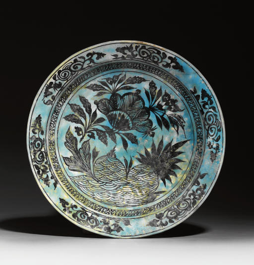 A TIMURID BLACK, WHITE AND TURQUOISE GLAZED POTTERY DISH , CENTRAL ASIA ...
