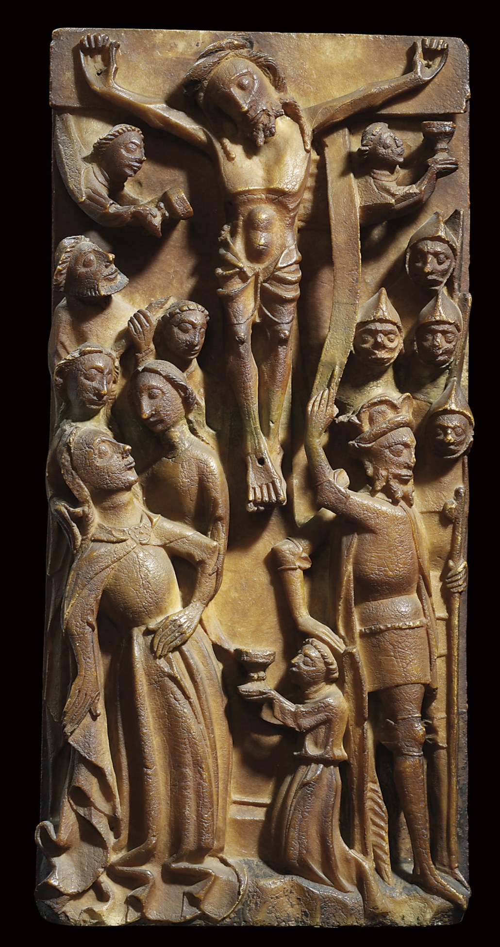 A RECTANGULAR POLYCHROME CARVED ALABASTER RELIEF OF THE CRUCIFIXION ...