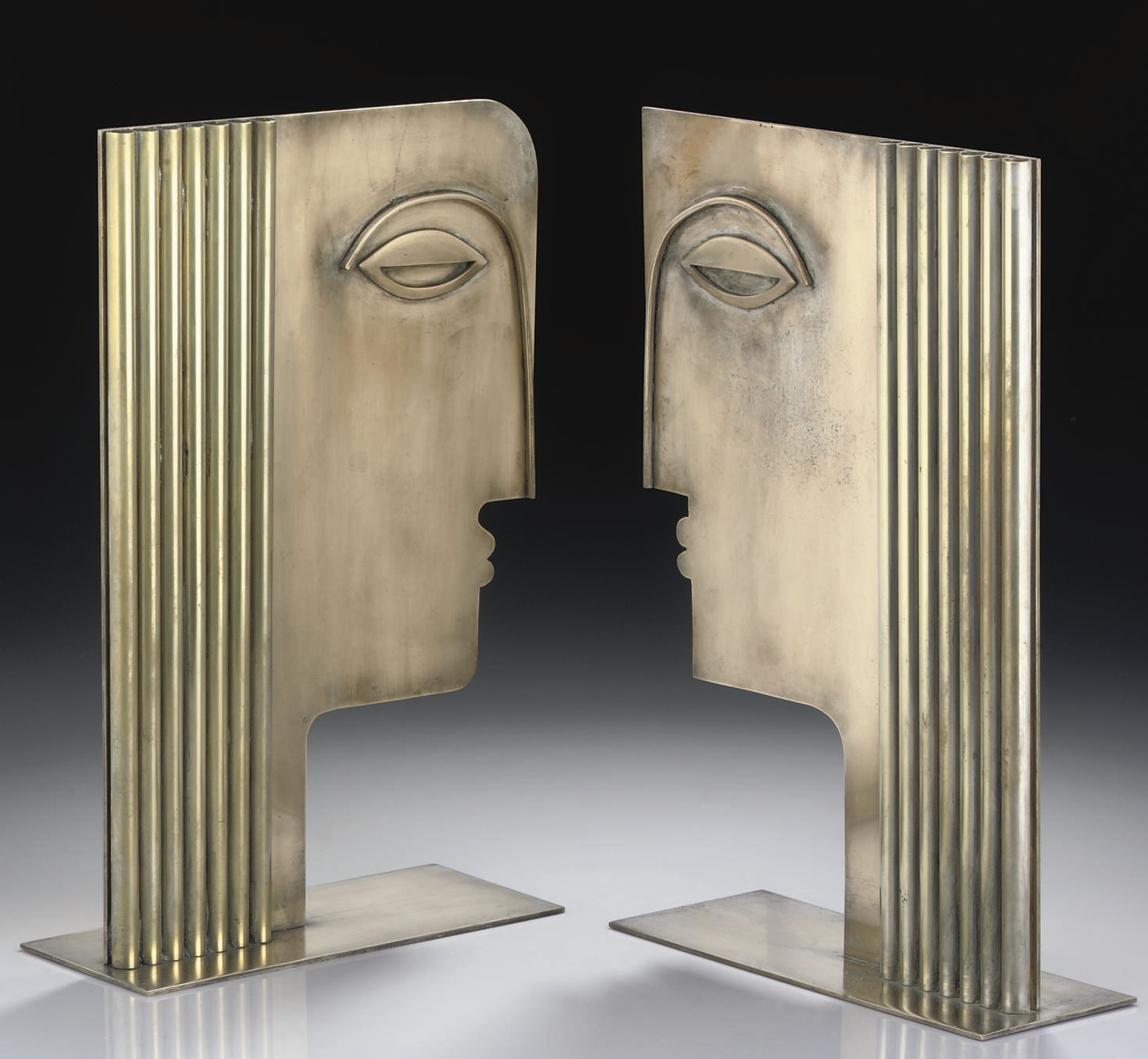 FRANZ HAGENAUER , A PAIR OF SILVERED-BRASS HEADS, CIRCA 1950 | Christie's