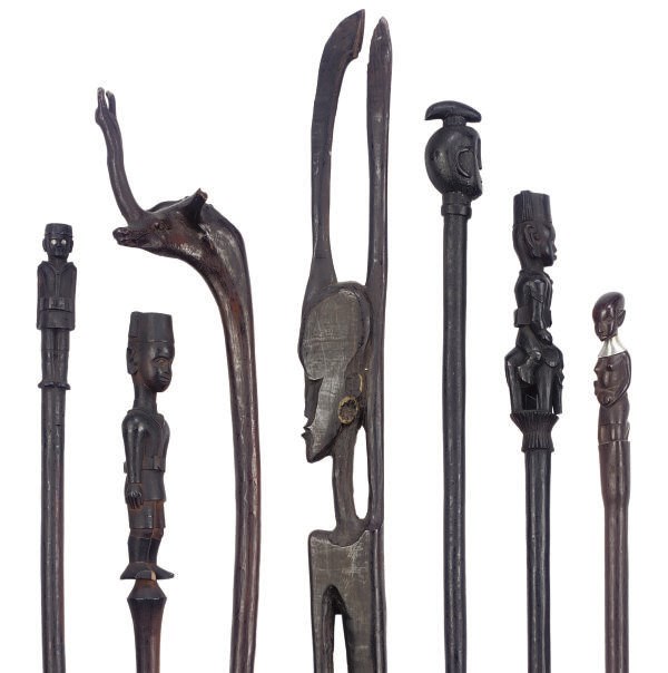 A COLLECTION OF AFRICAN CARVED WOOD WALKING STICKS AND STAFFS , EARLY ...