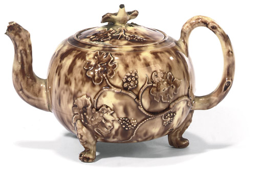 A STAFFORDSHIRE CREAMWARE 'WHIELDON-TYPE' GLOBULAR TEAPOT AND COVER