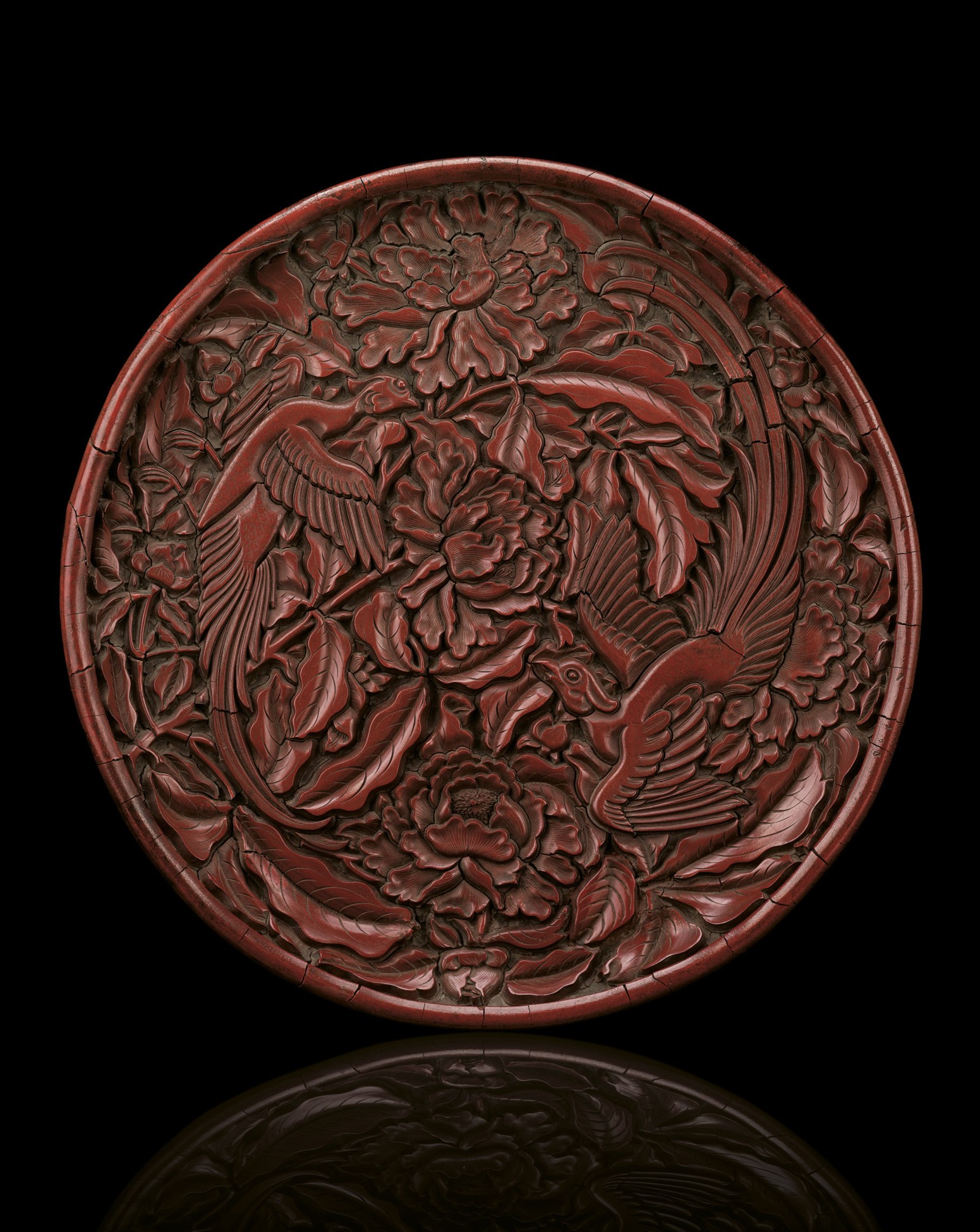 A VERY RARE AND FINELY CARVED CINNABAR LACQUER CIRCULAR DISH | Christie's