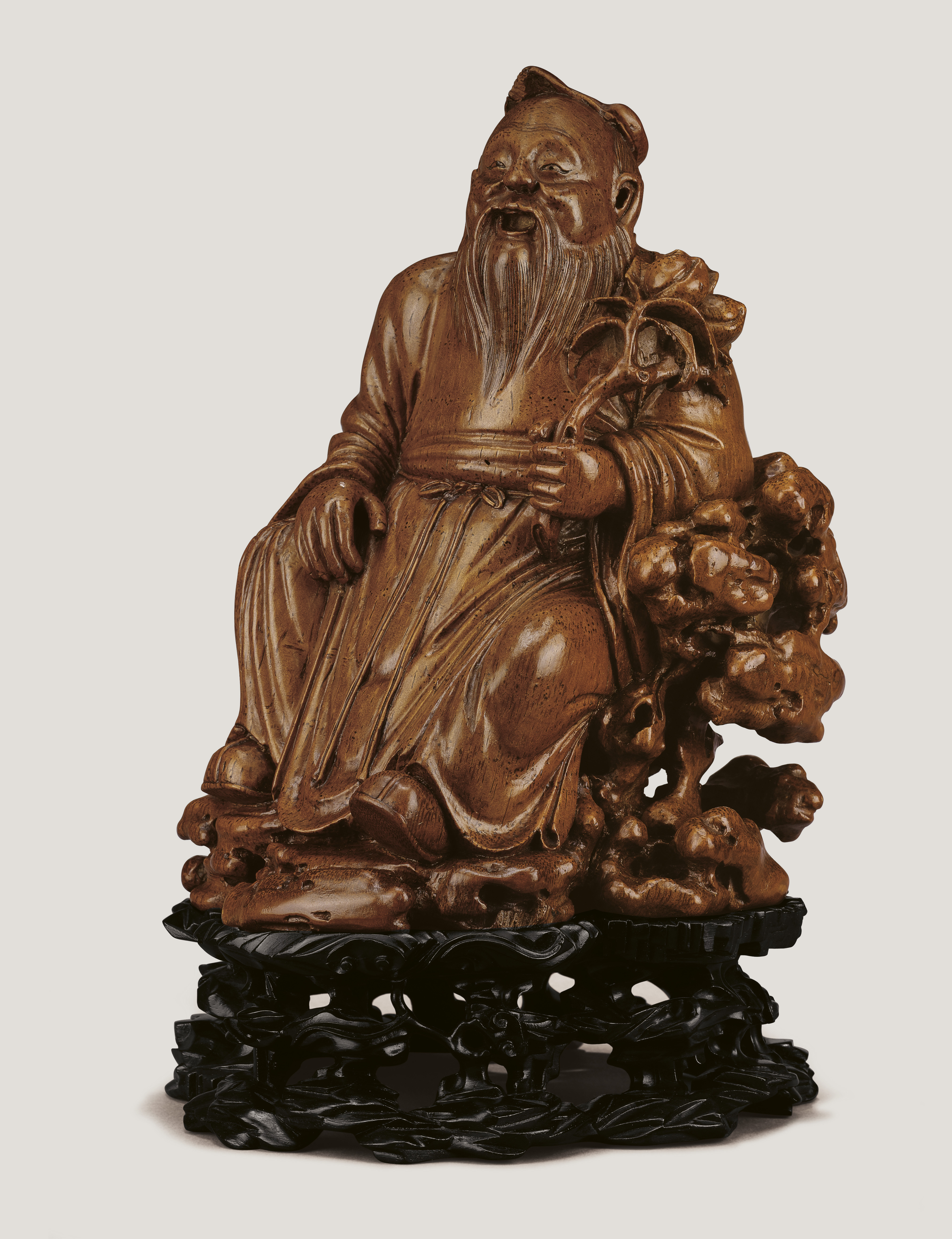 A WELL-CARVED BAMBOO FIGURE OF DONGFANG SHUO | Christie's