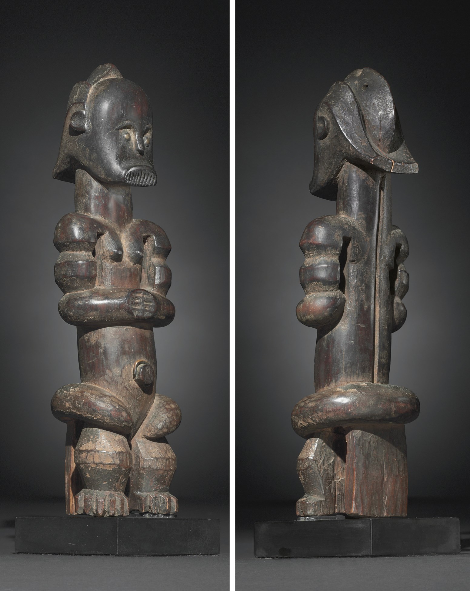 A FINE FANG FEMALE RELIQUARY FIGURE , Eyema byeri, standing with the ...