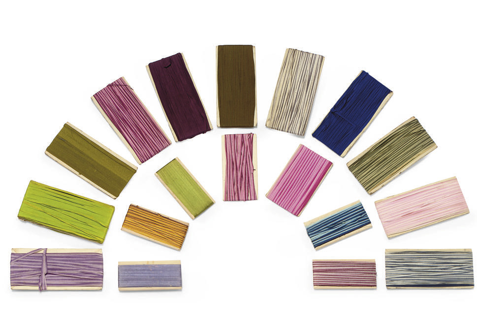 A COLLECTION OF SUN BONNETS AND A QUAKER APRON