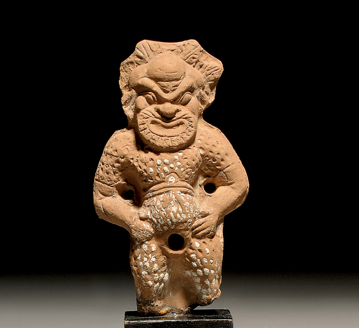 A GRAECO-EGYPTIAN TERRACOTTA ITHYPHALLIC COMIC ACTOR