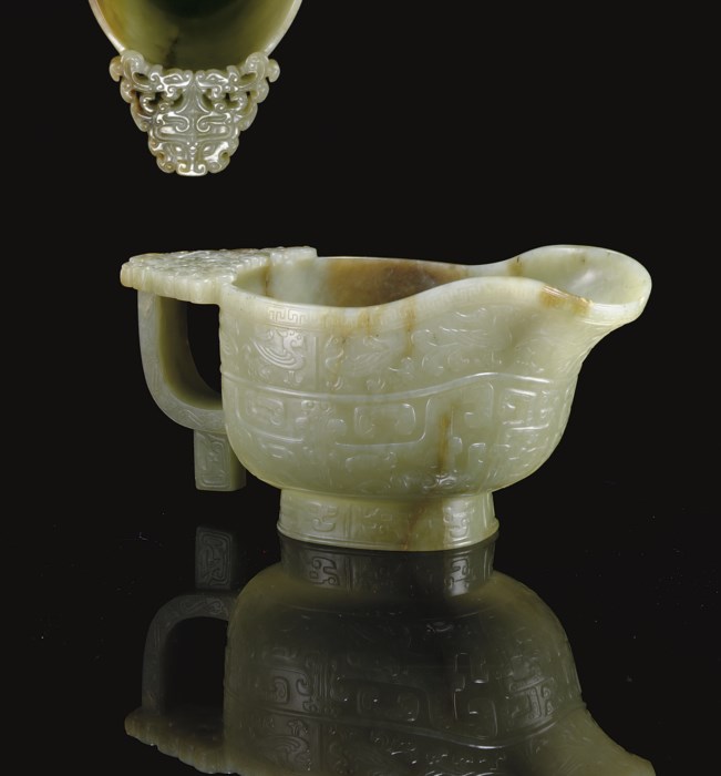 A UNUSUAL LARGE PALE GREYISH-GREEN JADE ARCHAISTIC POURING VESSEL, YI ...