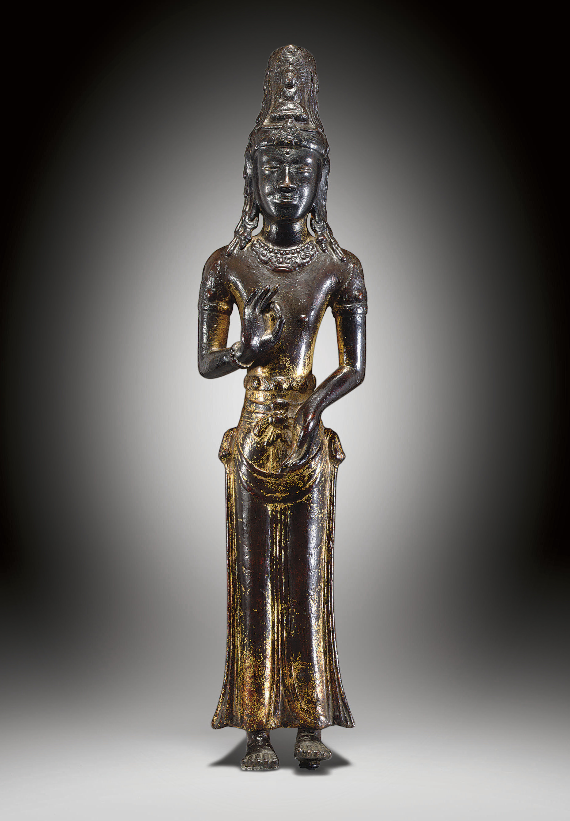 A RARE LACQUERED BRONZE FIGURE OF ACUOYE GUANYIN