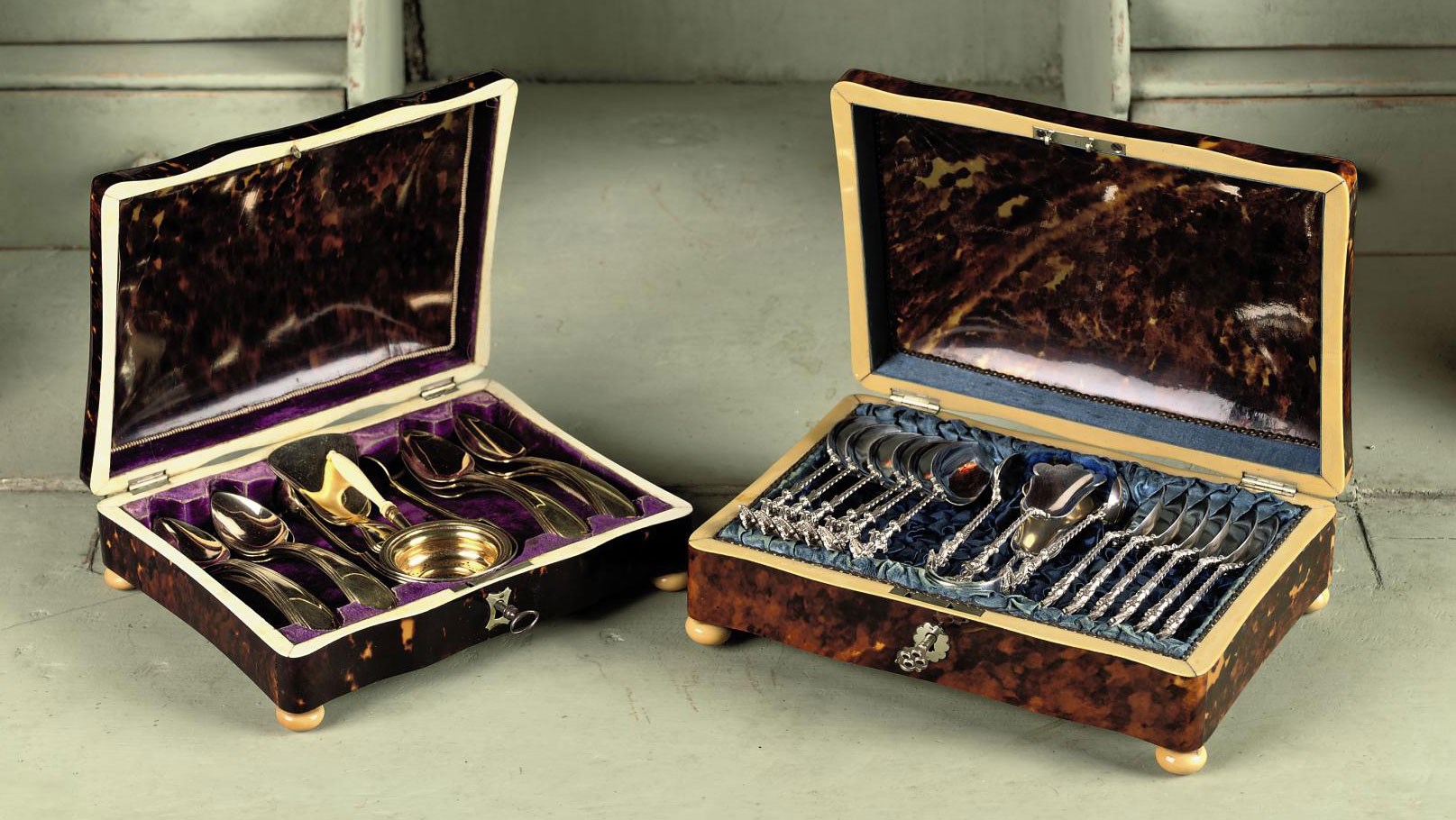 Two tortoise-shell spoon boxes with silver and silver-gilt tea-spoons ...