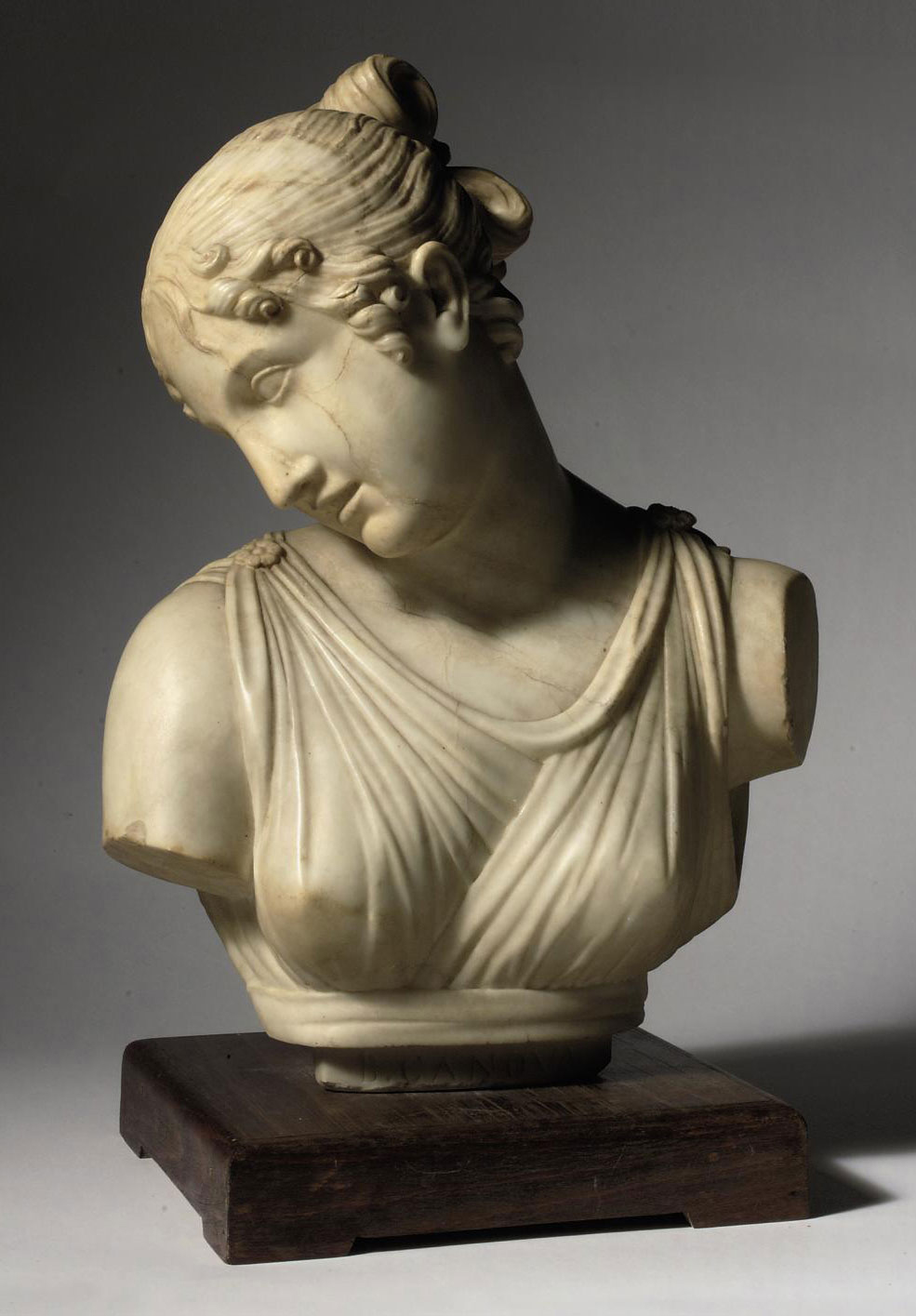 A CARVED MARBLE BUST OF VENUS