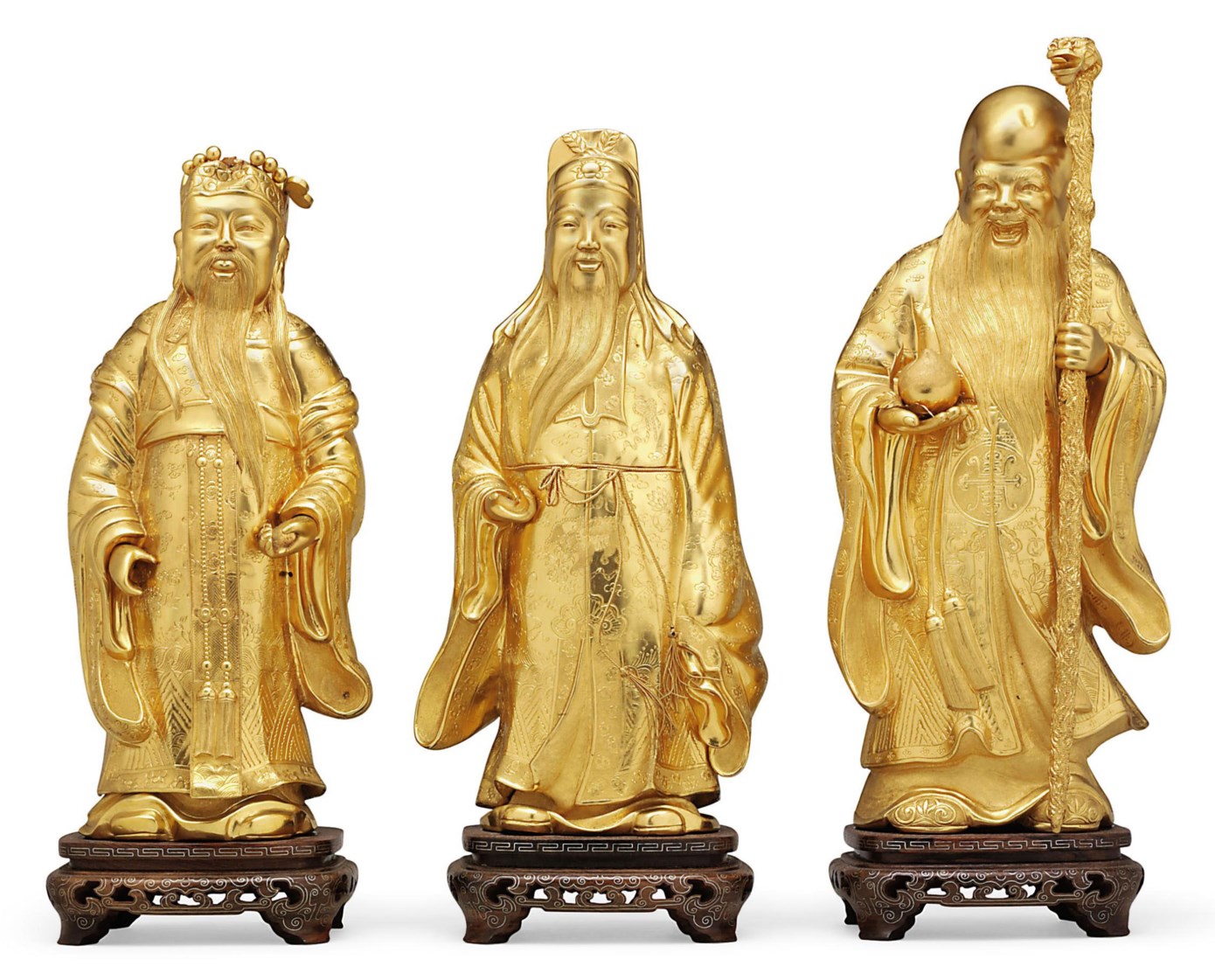 A GROUP OF THREE CHINESE GOLD EMBOSSED IMMORTALS , 20TH CENTURY, WITH ...