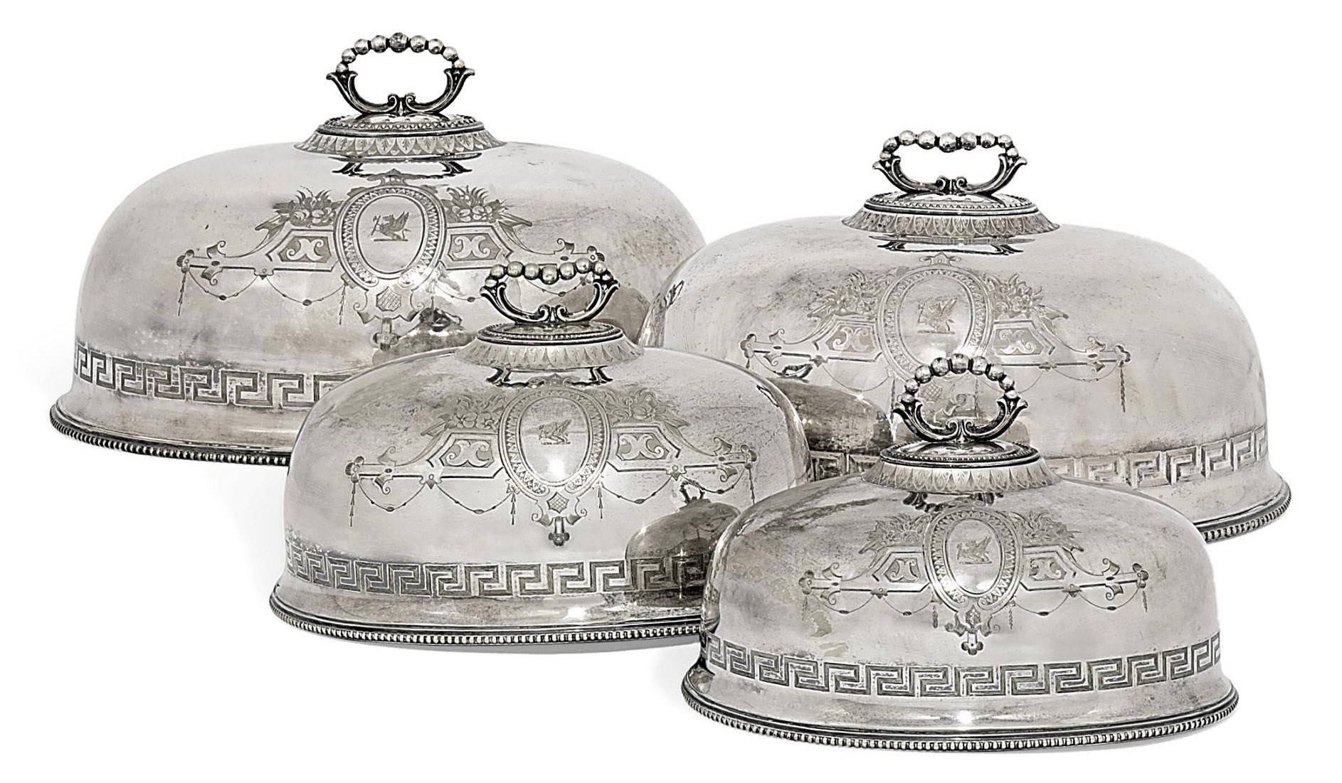 A GRADUATED SET OF VICTORIAN SILVER-PLATE MEAT-DISH COVERS