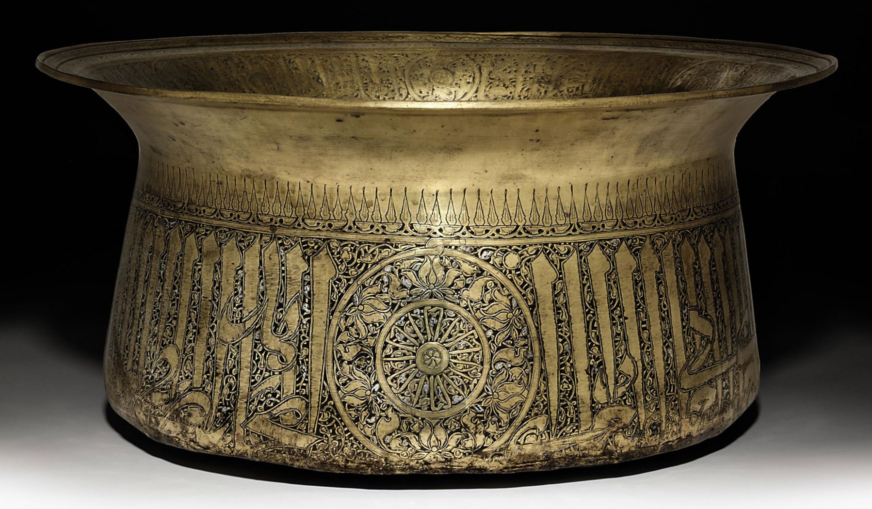 A LARGE MAMLUK SILVER-INLAID BRASS BASIN , EGYPT, AL-NASIR MUHAMMAD ...
