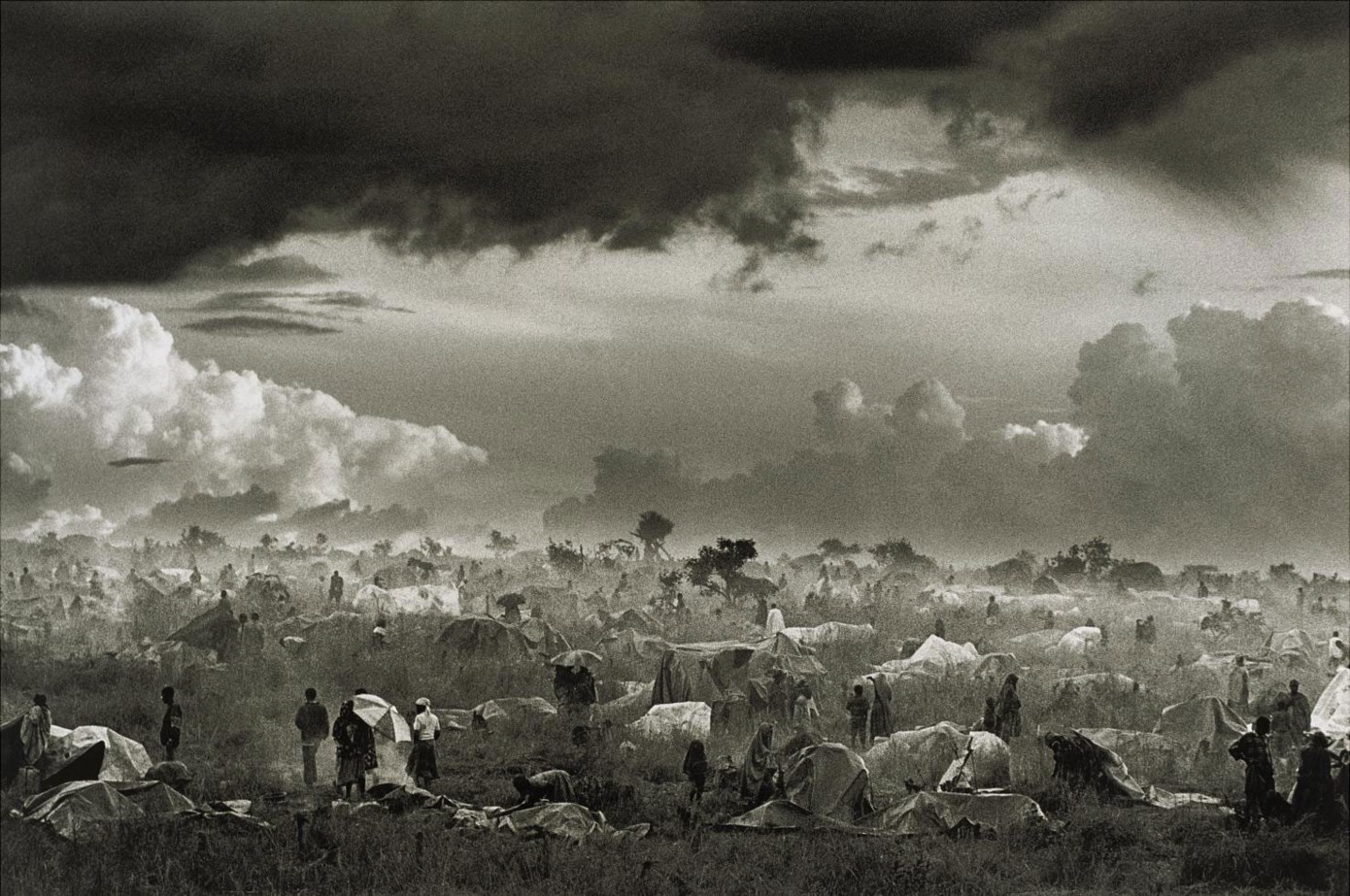 SEBASTIAO SALGADO (B. 1944) , The first day of installation of the camp ...