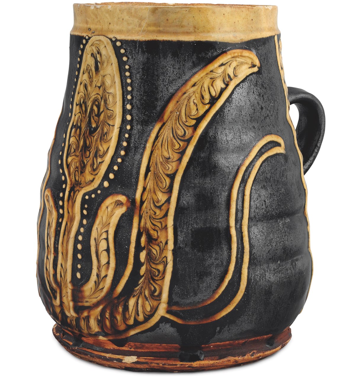 A STAFFORDSHIRE SLIPWARE MUG