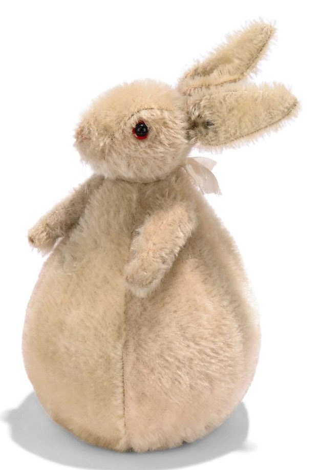 A STEIFF ROLY-POLY RABBIT, (323), pale pink and white mohair, black ...