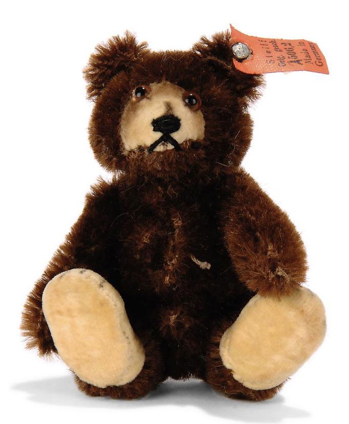 A STEIFF MINIATURE TEDDY BABY, (7309), jointed, brown mohair, brown and ...