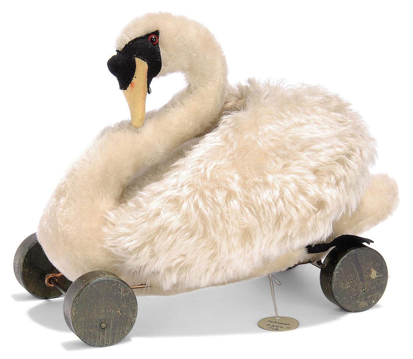 A STEIFF ARCHIVE MOHAIR SWAN ON WHEELS, (2322), white, black boot ...