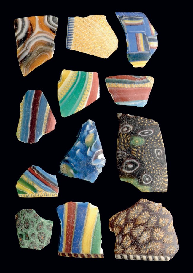 TWELVE ROMAN POLYCHROME GLASS FRAGMENTS , CIRCA 1ST CENTURY B.C./A.D ...