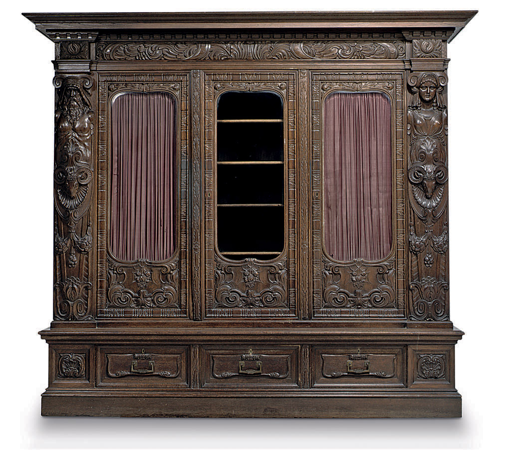 A GERMAN CARVED OAK LIBRARY BOOKCASE
