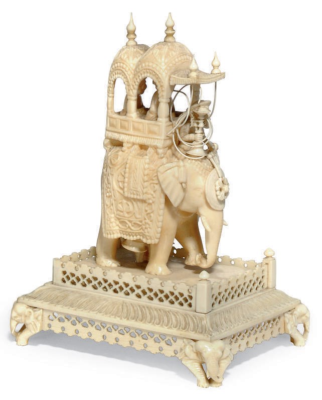 AN INDIAN IVORY ELEPHANT HOWDAH MODEL
