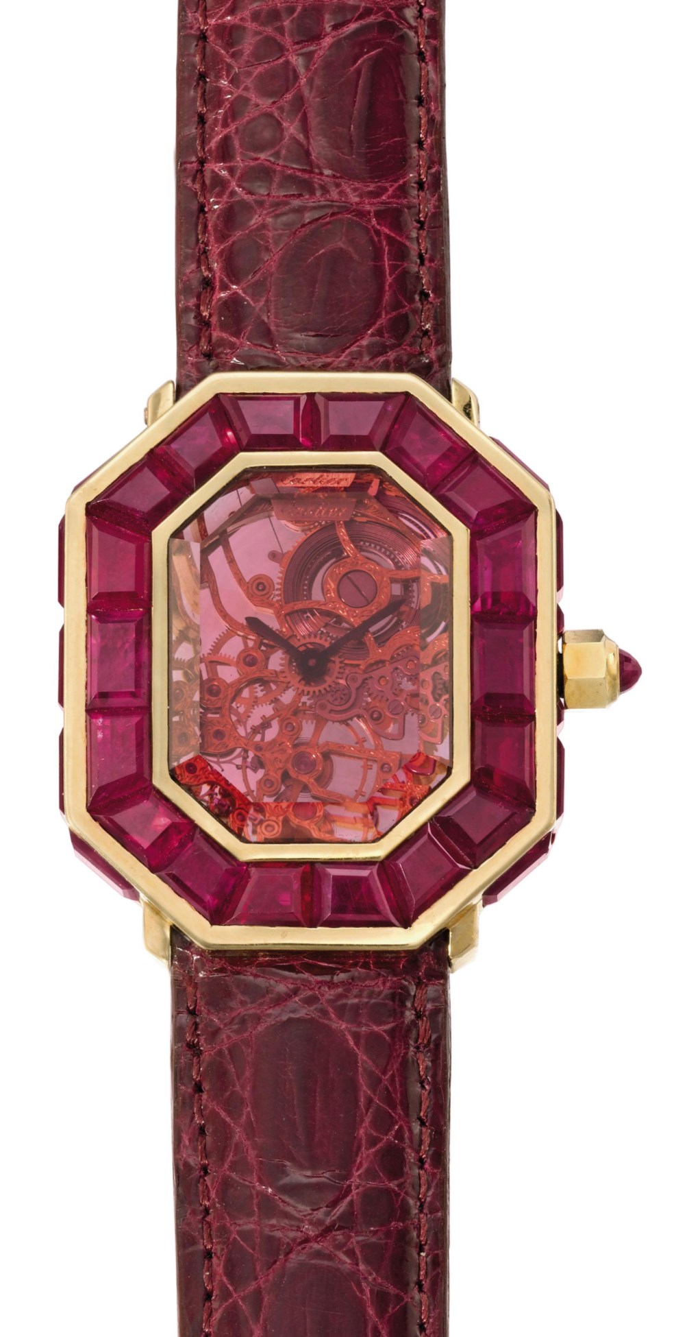 Cartier. A unique 18K gold and ruby-set octagonal skeletonized ...