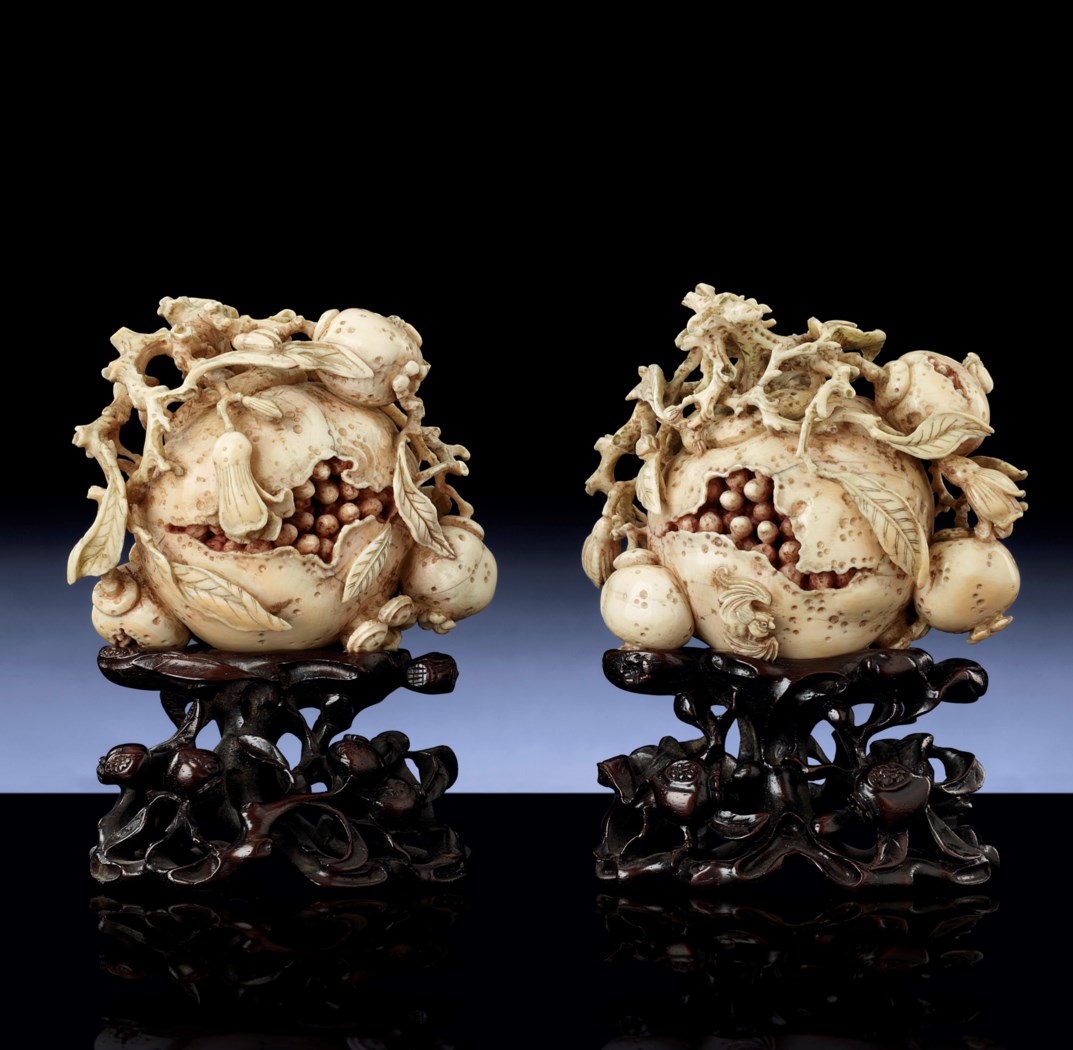 A RARE PAIR OF POLYCHROME IVORY POMEGRANATE CARVINGS | Christie's