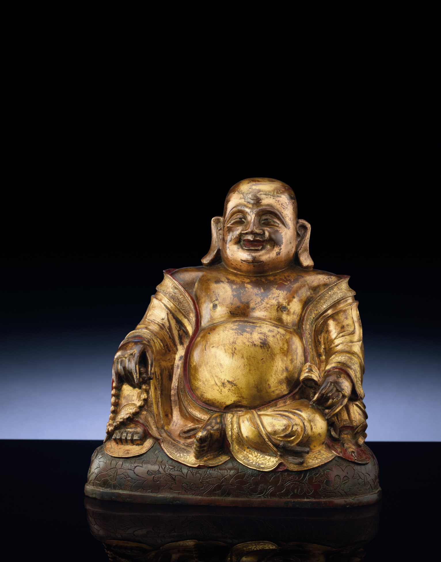 A GILT-BRONZE FIGURE OF BUDAI | Christie's