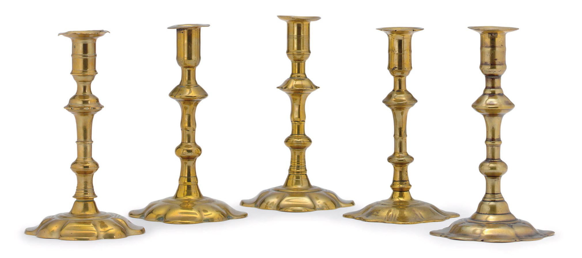 A MISCELLANEOUS GROUP OF FIVE MARKED GEORGE II BRASS CANDLESTICKS ...