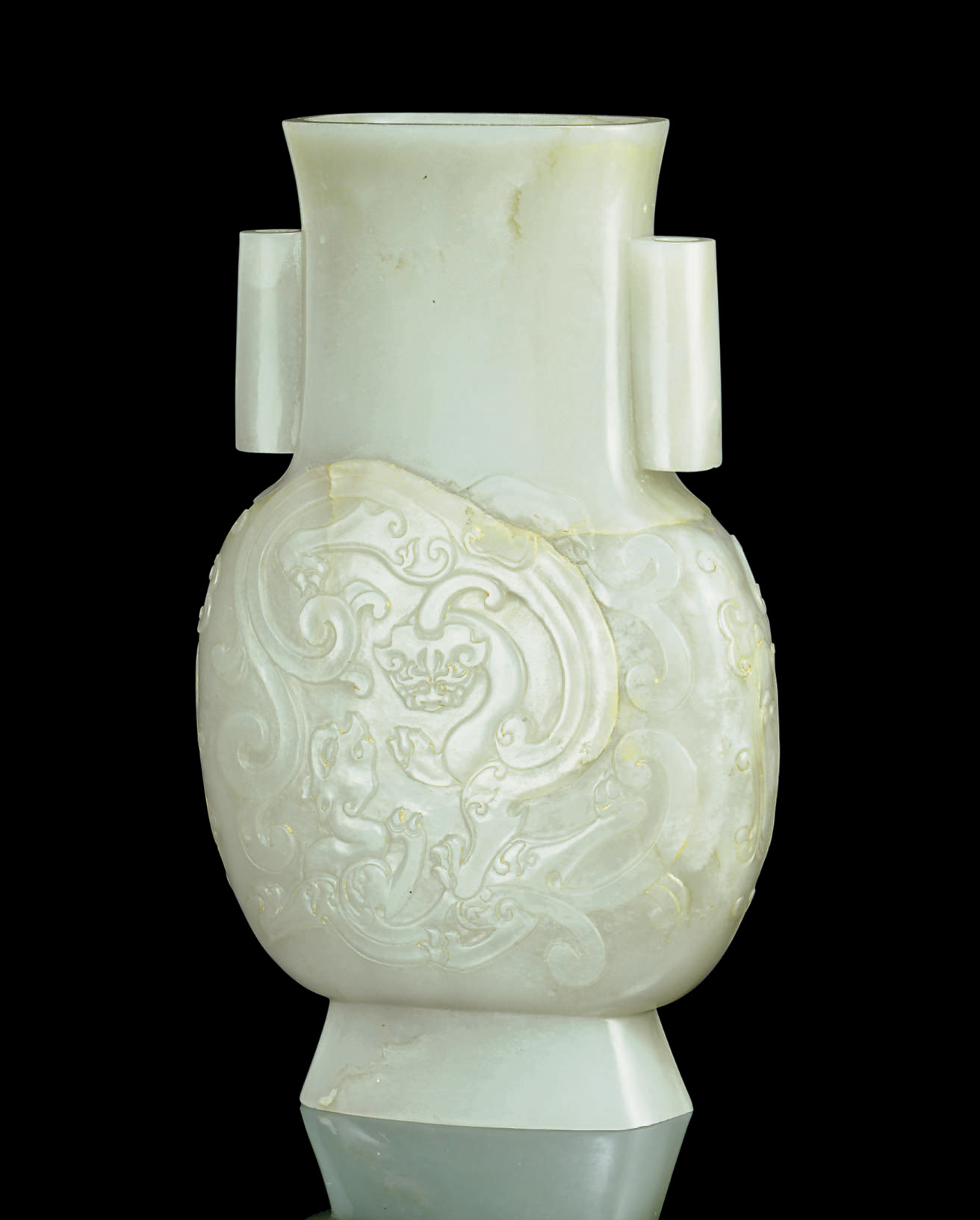 A PALE GREEN JADE ARCHAISTIC VASE