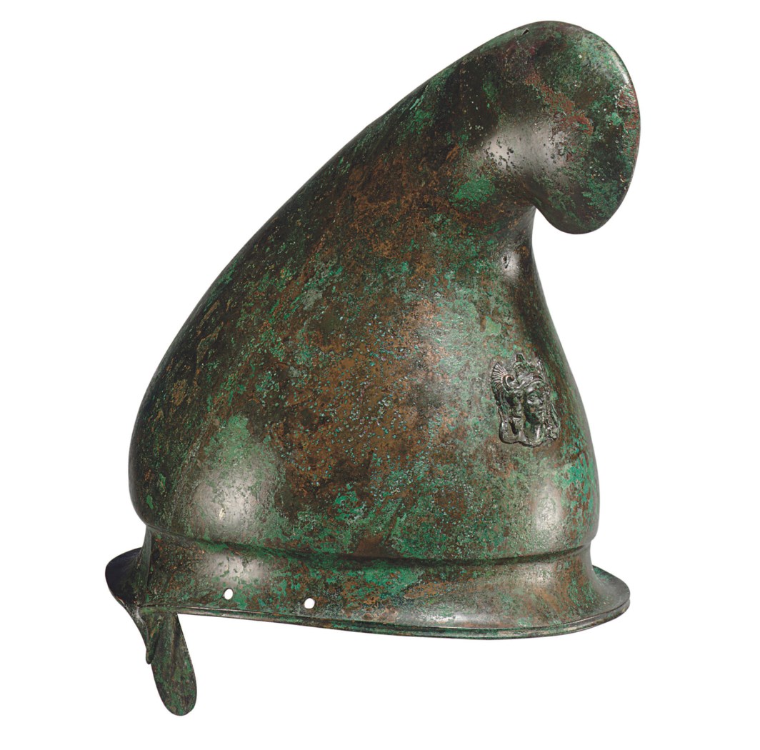 A GREEK BRONZE HELMET OF PHRYGIAN TYPE , LATE CLASSICAL TO EARLY ...
