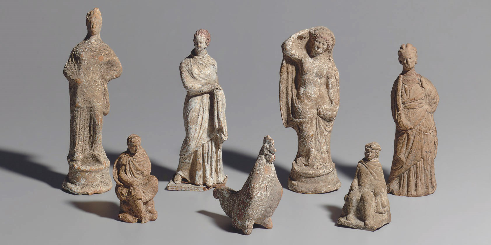 SEVEN GREEK TERRACOTTA FIGURES , CIRCA 5TH-3RD CENTURY B.C. | Christie's