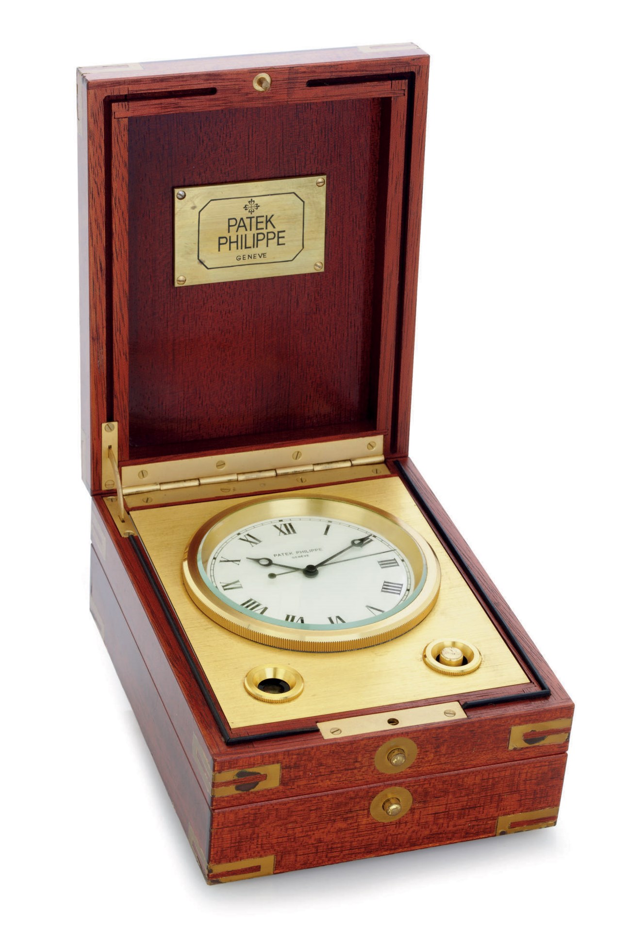 PATEK PHILIPPE. A GILT BRASS AND MAHOGANY CASE DESK CLOCK WITH CENTER ...