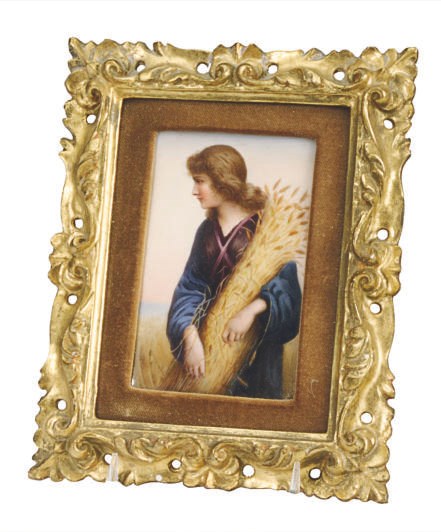 A CONTINENTAL PORCELAIN PLAQUE OF RUTH HOLDING A SHEATH OF WHEAT ...