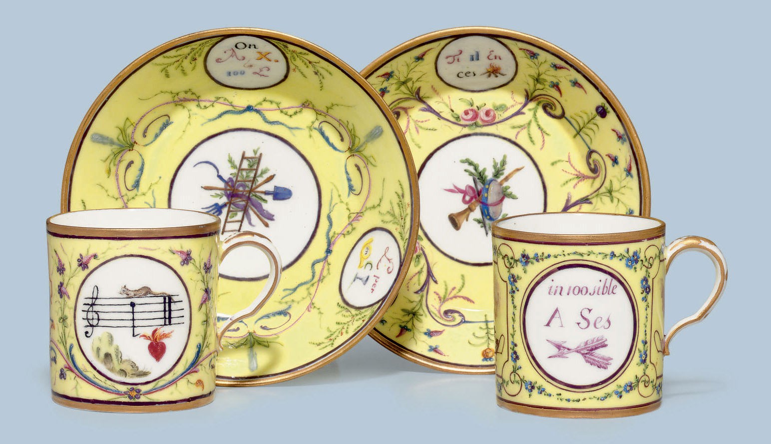 TWO SEVRES PORCELAIN PALE-YELLOW GROUND CUPS AND SAUCERS (GOBELETS ...