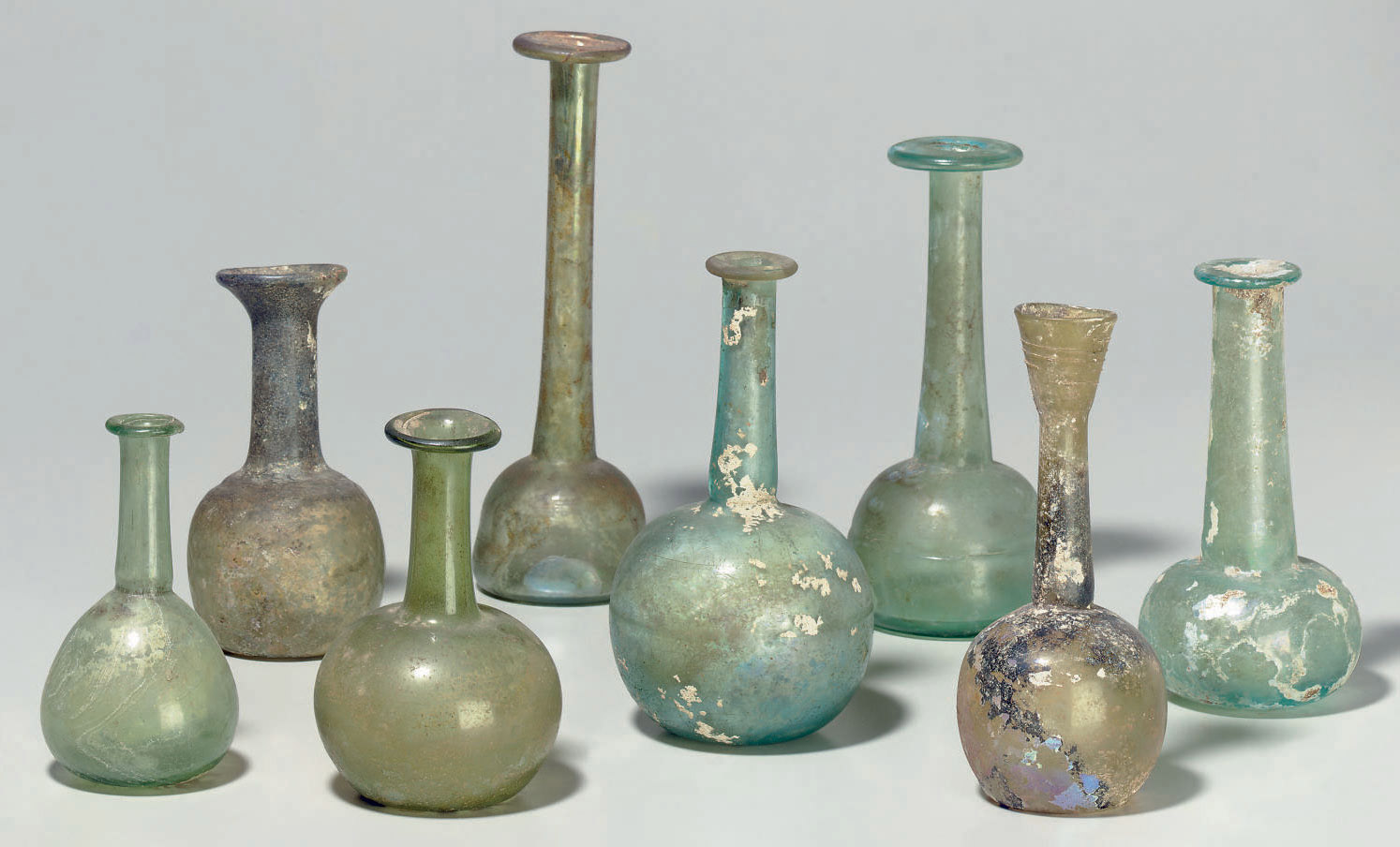 EIGHT ROMAN GLASS BOTTLES