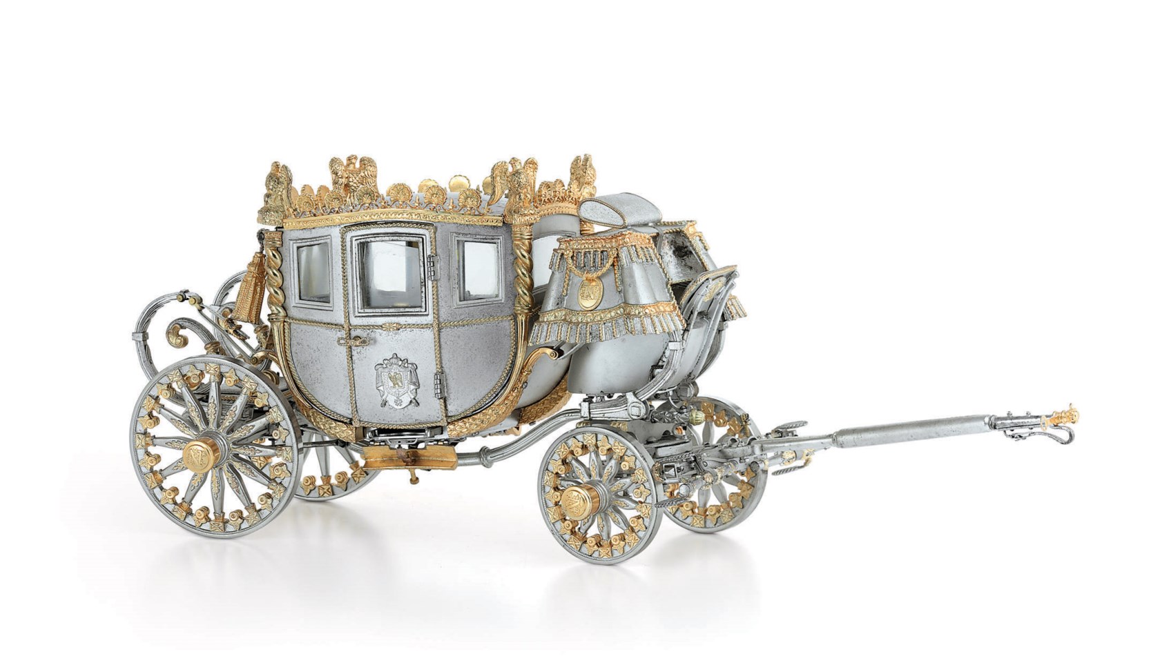 AN AMERICAN PARCEL-GILT SILVER MODEL OF A CORONATION COACH , DESIGNED ...