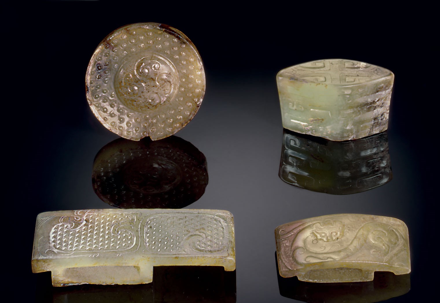 FOUR JADE SWORD FITTINGS