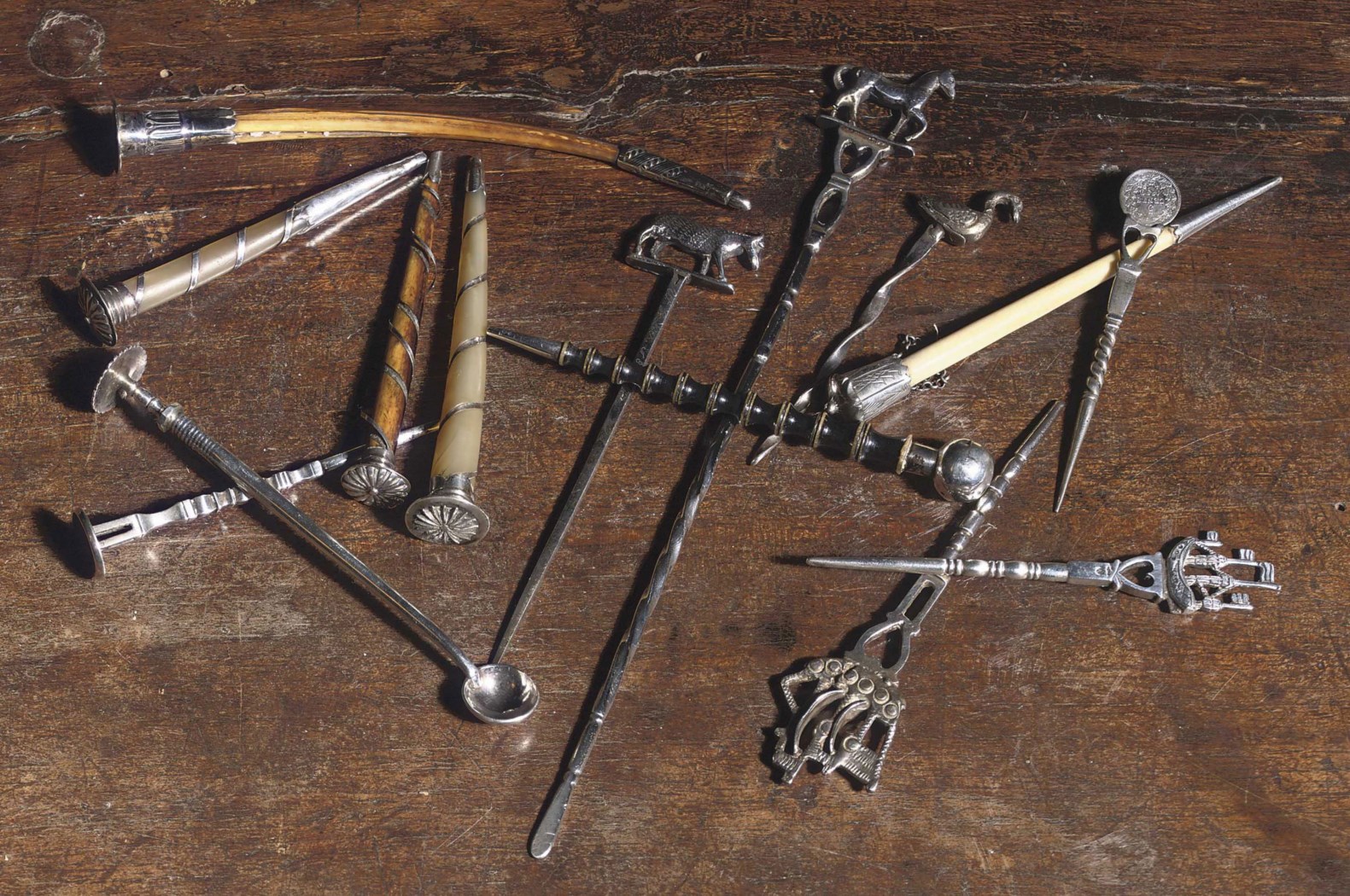 Fourteen various Dutch silver and silver-mounted pipe cleaners ...