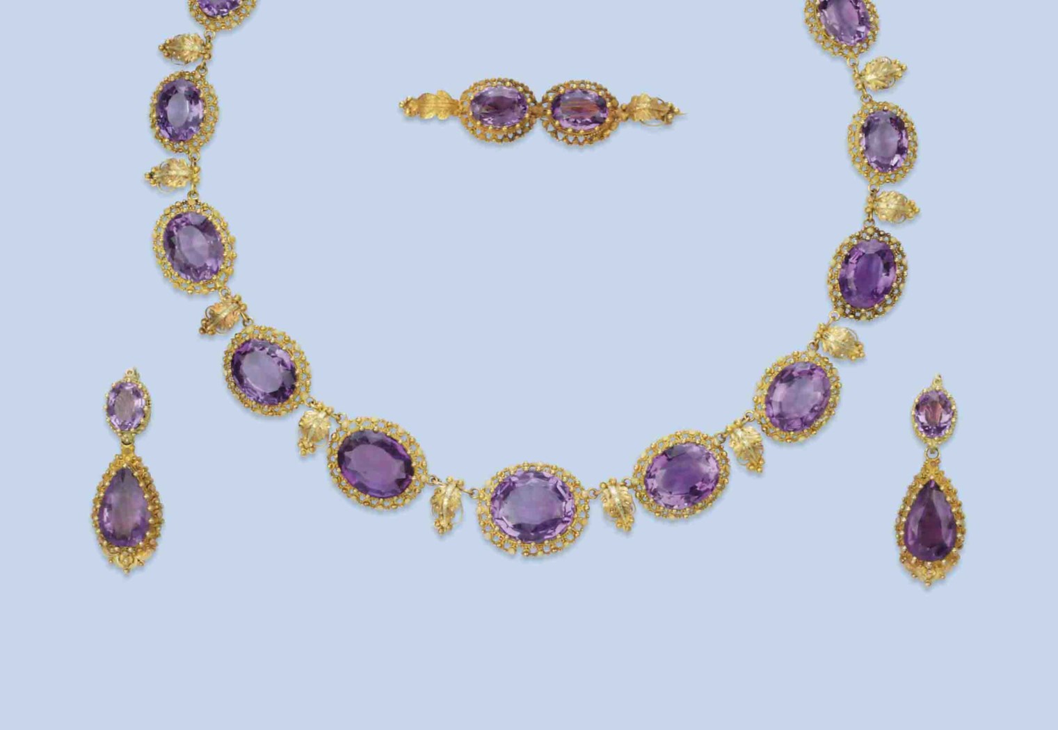 AN ANTIQUE GILT AMETHYST PARURE | Christie's