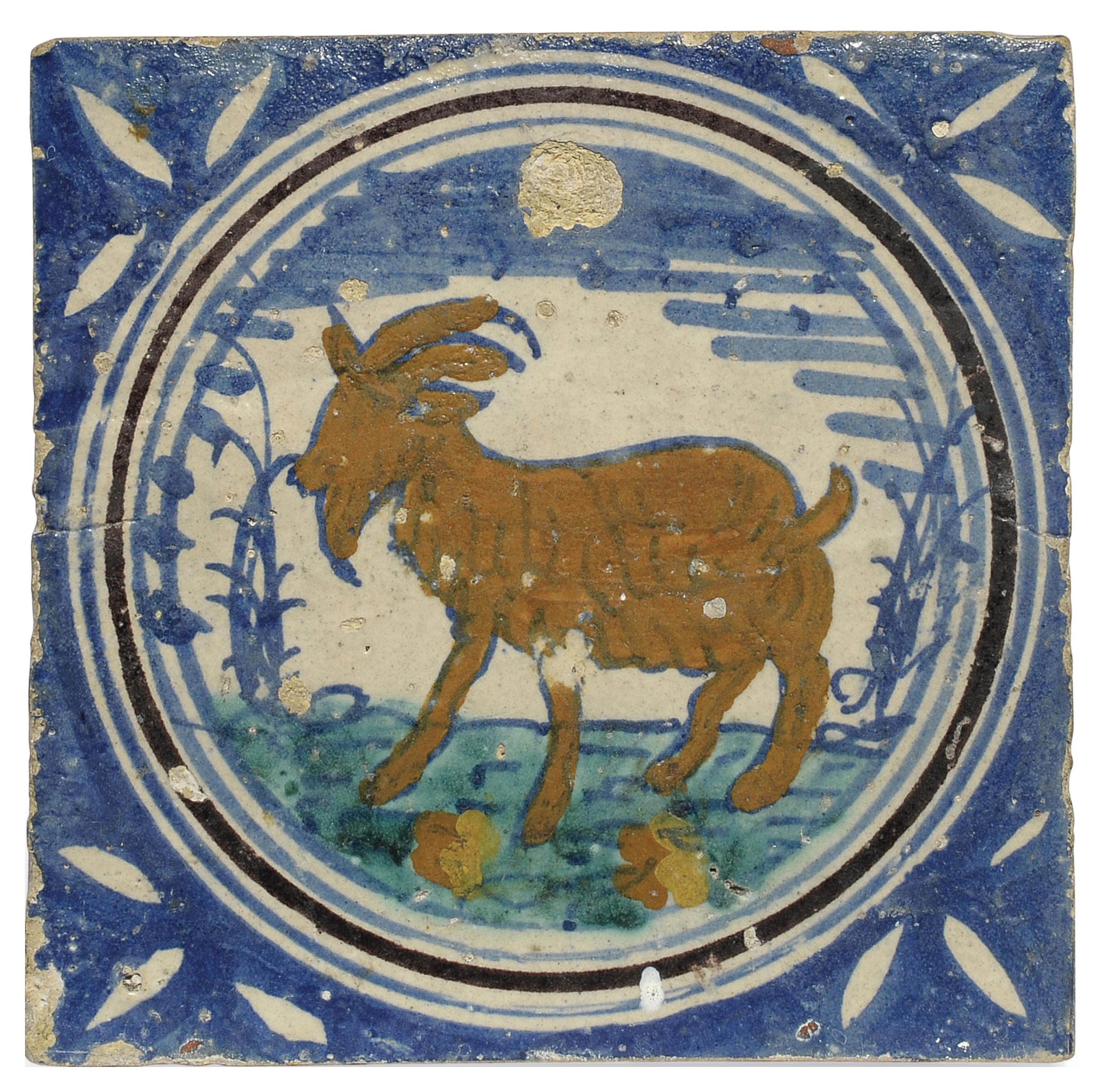 A TIN-GLAZED EARTHENWARE POLYCHROME FLOOR TILE