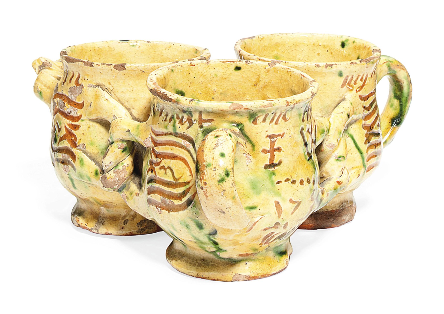 A DONYATT INCISED SLIPWARE DATED FUDDLING-CUP , 1739 | Christie's