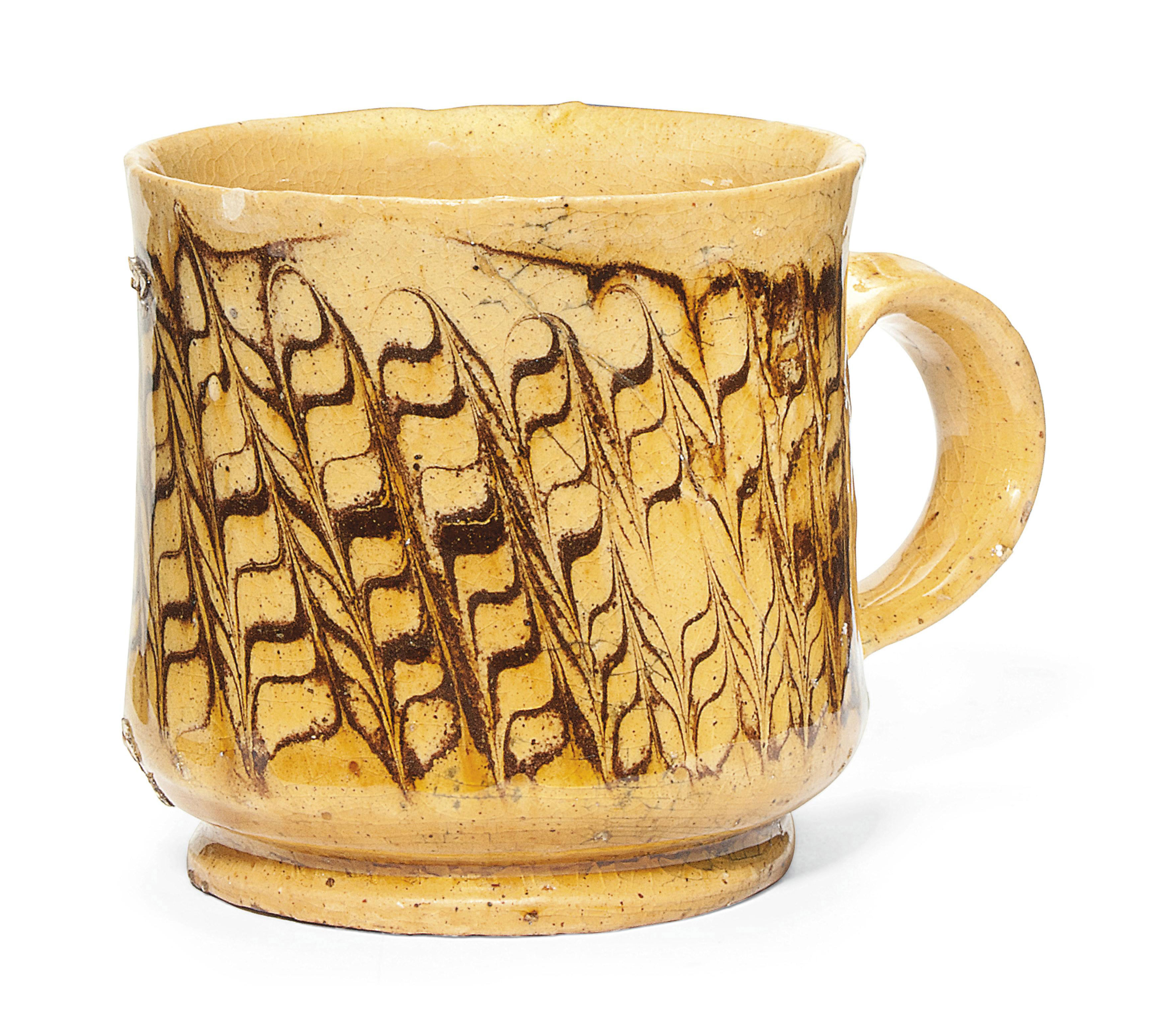 A STAFFORDSHIRE SLIPWARE SMALL TAPERING CYLINDRICAL MUG , CIRCA 1700 ...